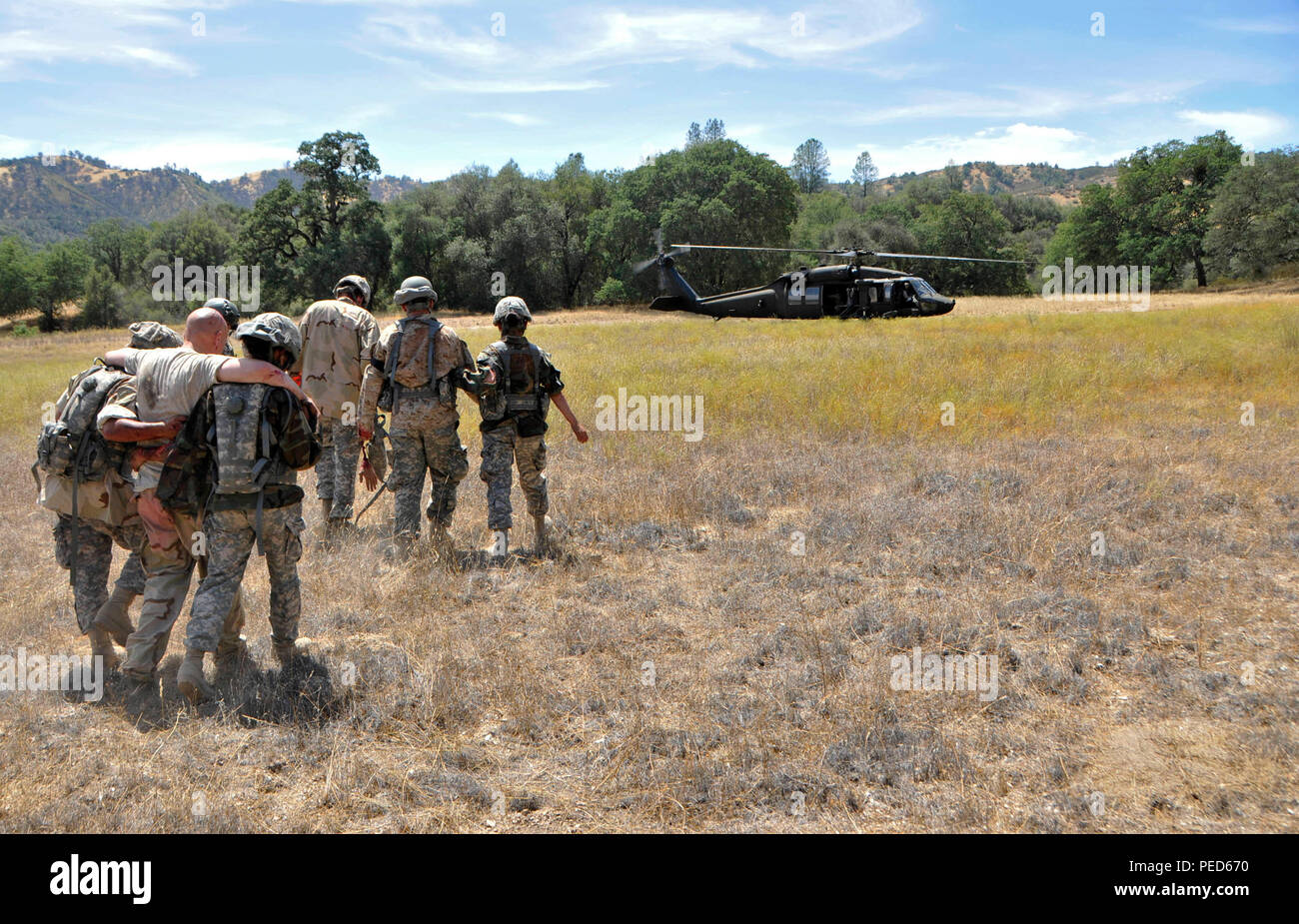 Soldiers from the 325th Combat Support Hospital move casualties to an ...