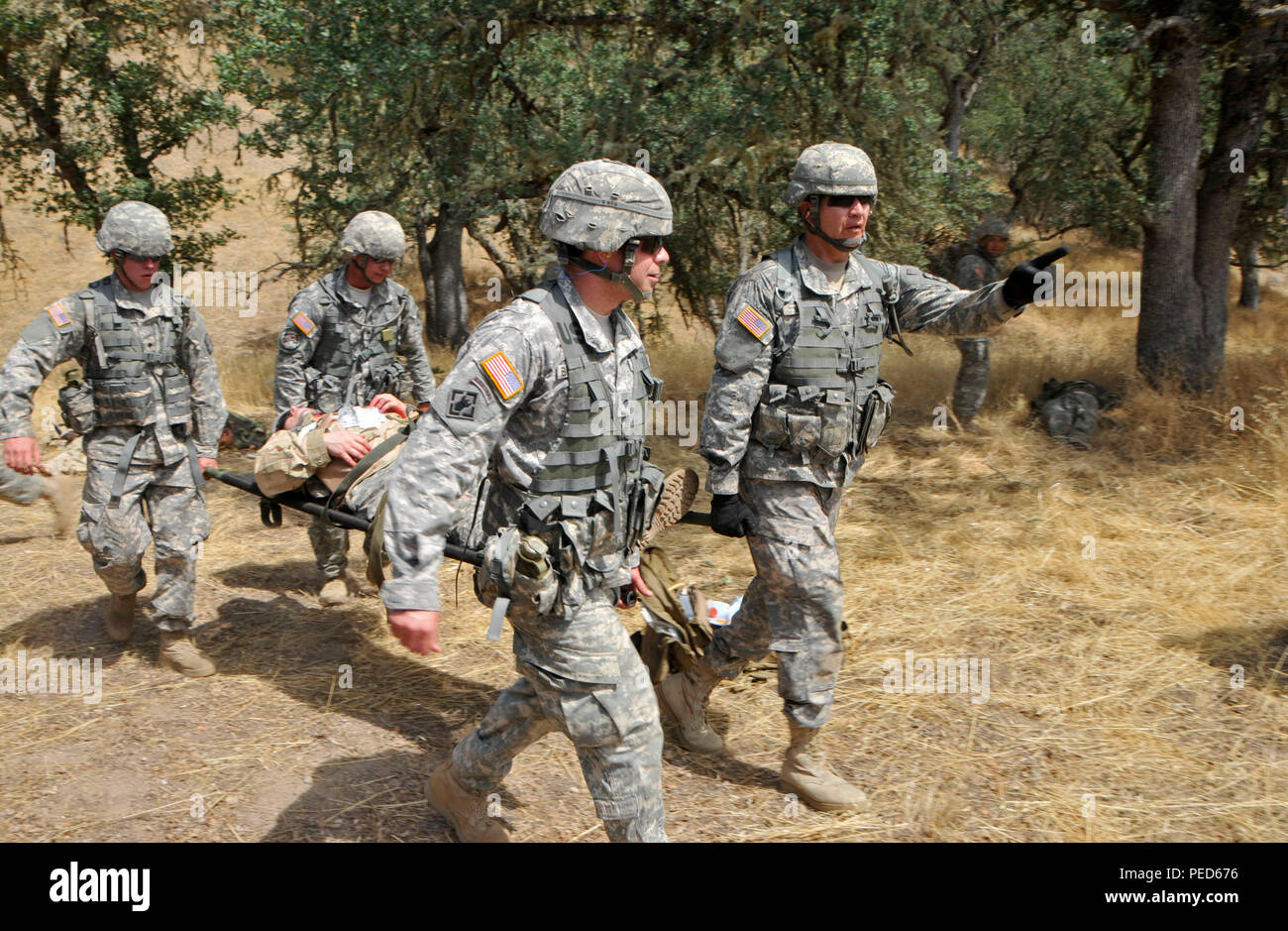 Soldiers from the 325th Combat Support Hospital move injured personnel ...