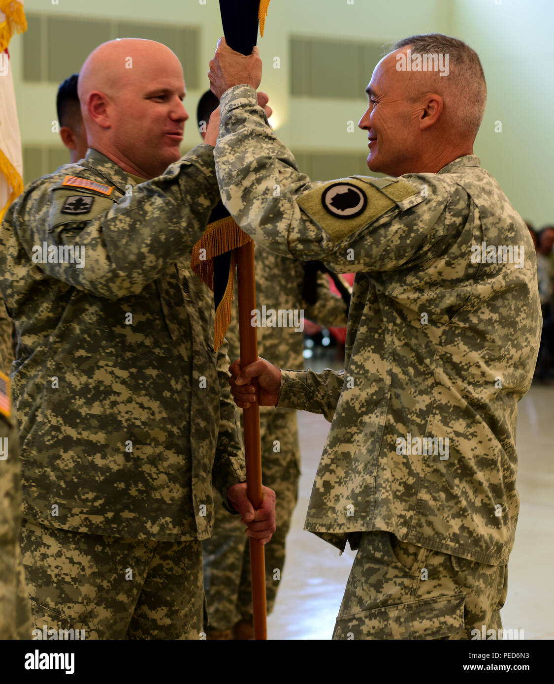 Command Sgt. Maj. Dana Wingad (left) hands the guide on to Brig. Gen ...