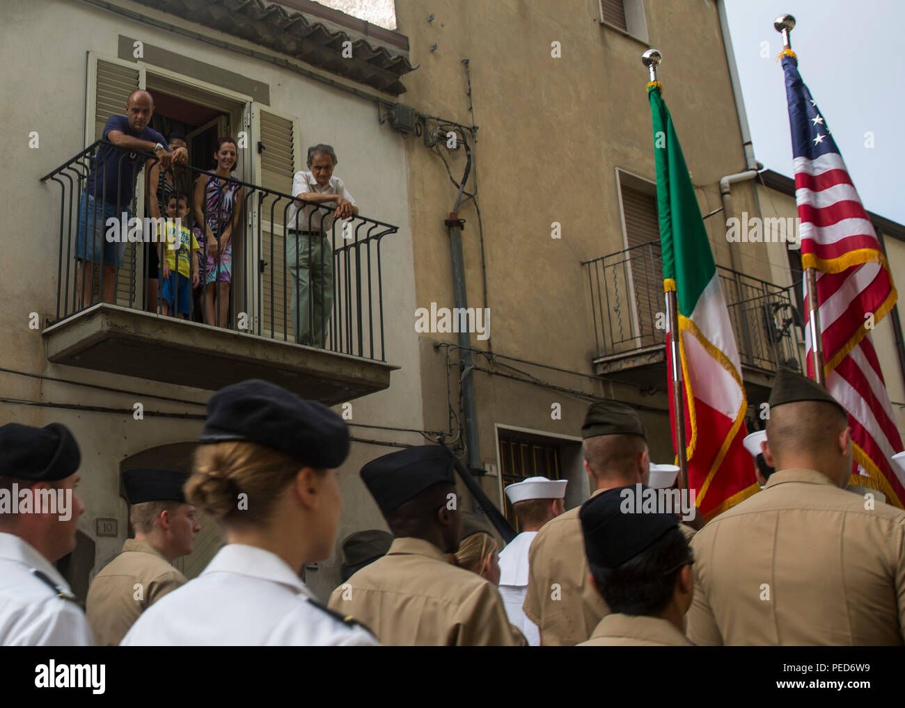 Residents of Troina, Sicily, Italy, overlook the Marines and sailors ...