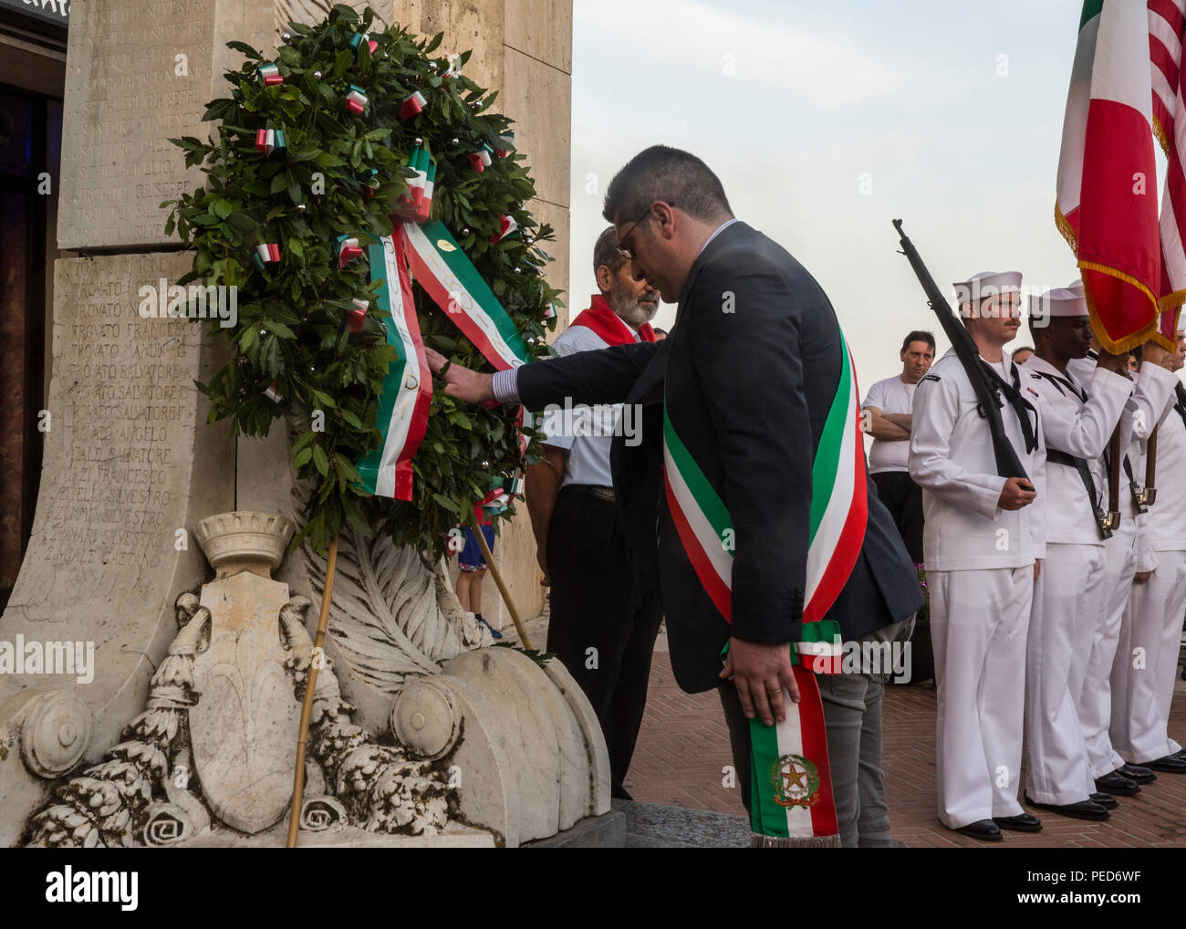 Fabio Venezia, mayor of Troina, Sicily, Italy, pays his respects during ...