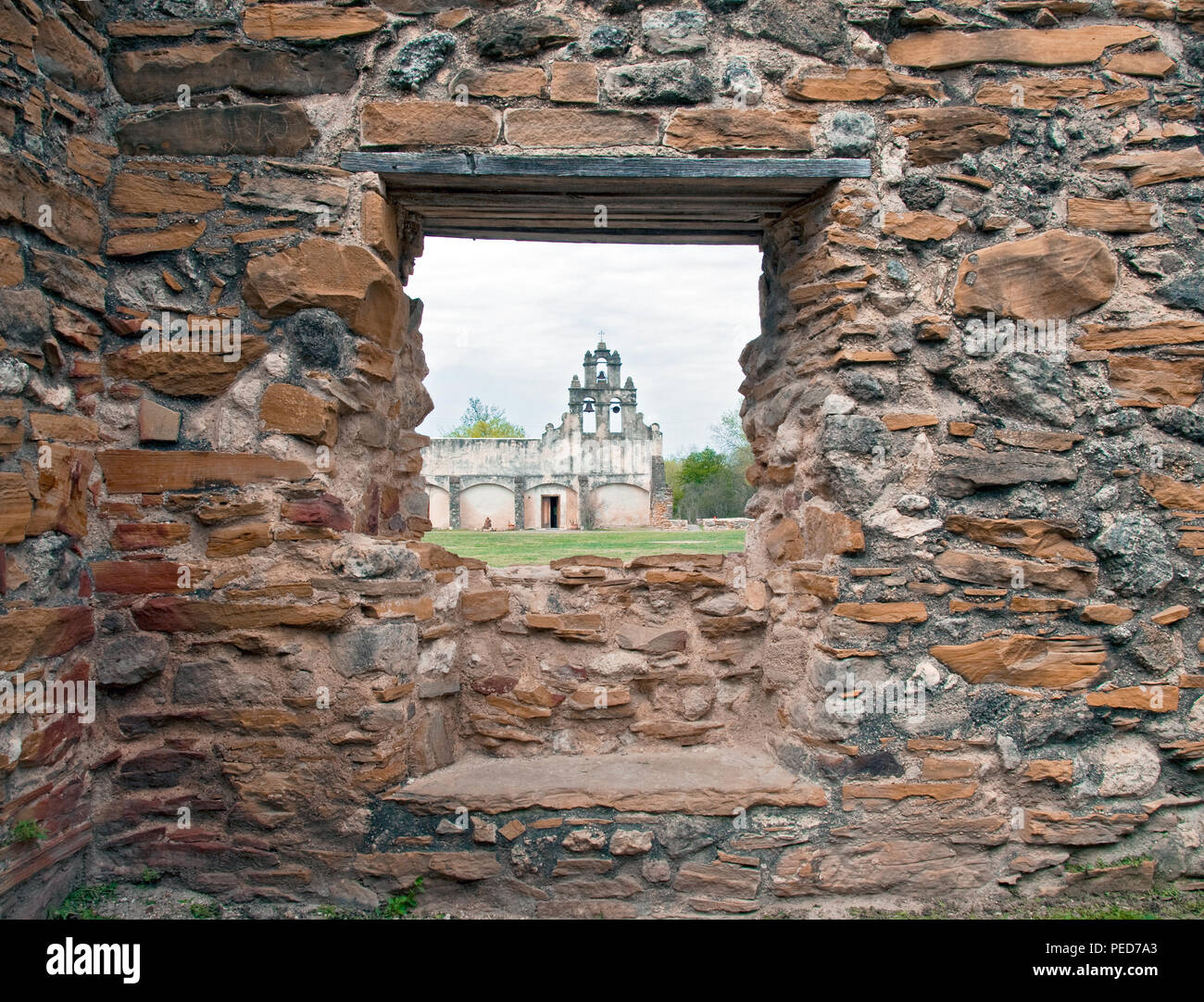 Mission Chapel seen through a stone window frame of mission wall ...