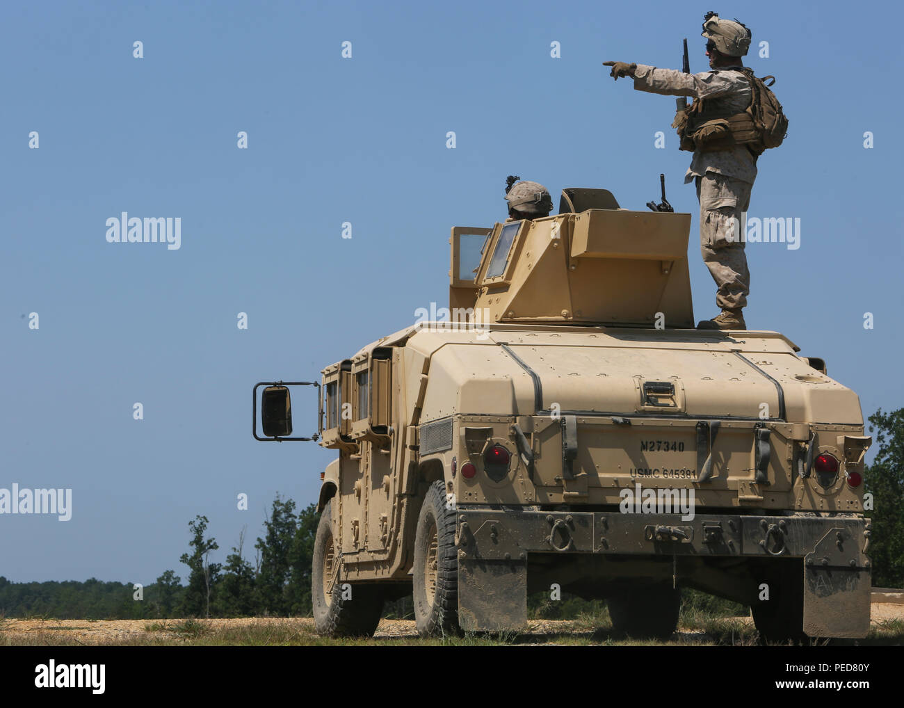 A Marine with Support Company, 2nd Combat Engineer Battalion, instructs ...