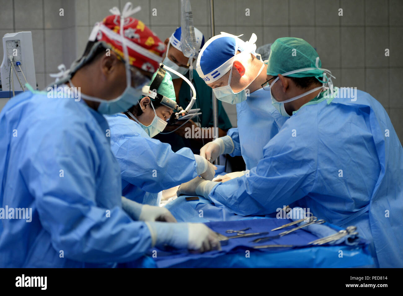 U.S. Air Force doctors perform a surgery with Honduran doctors in the ...