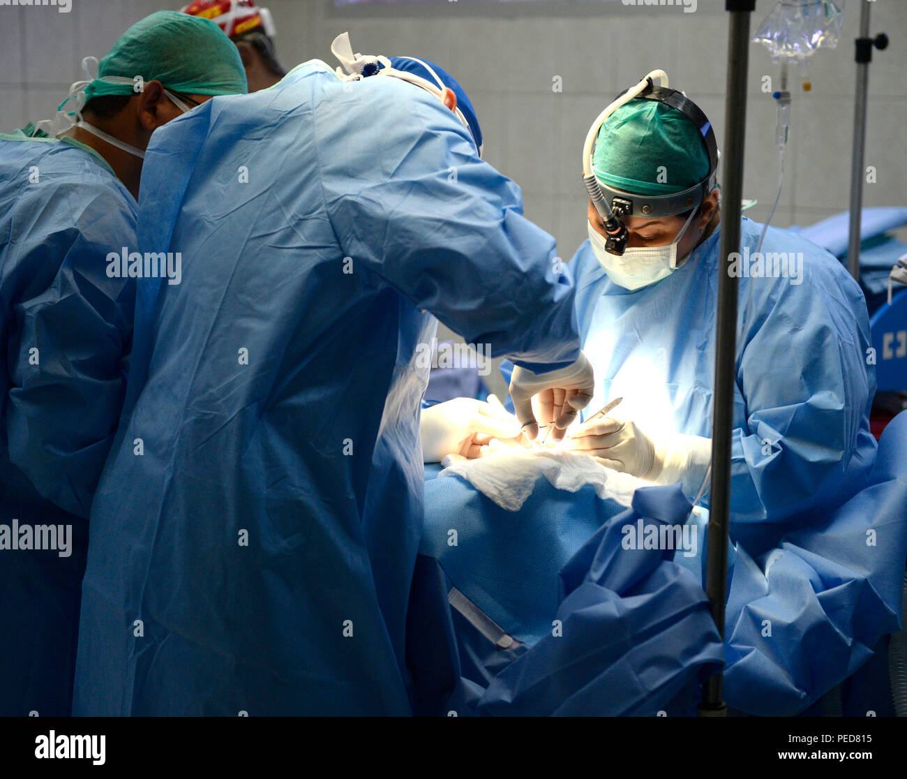 U.S. Air Force doctors perform a surgery with Honduran doctors in the ...