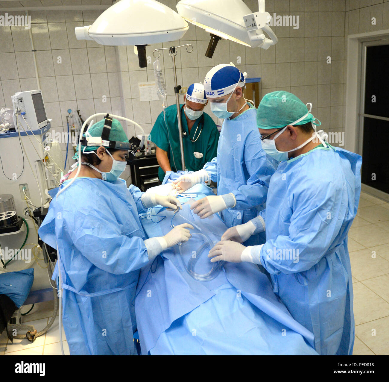 U.S. Air Force doctors perform a surgery with Honduran doctors in the ...