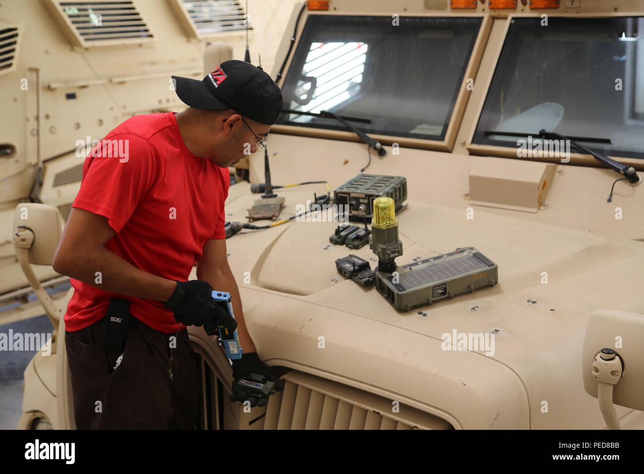 A Multi Integrated Laser Engagement System (MILES) specialist installs ...