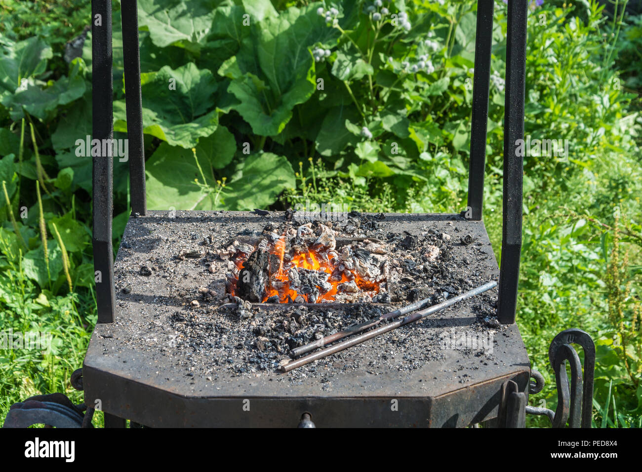 Small forge with bright red burning coals Stock Photo - Alamy
