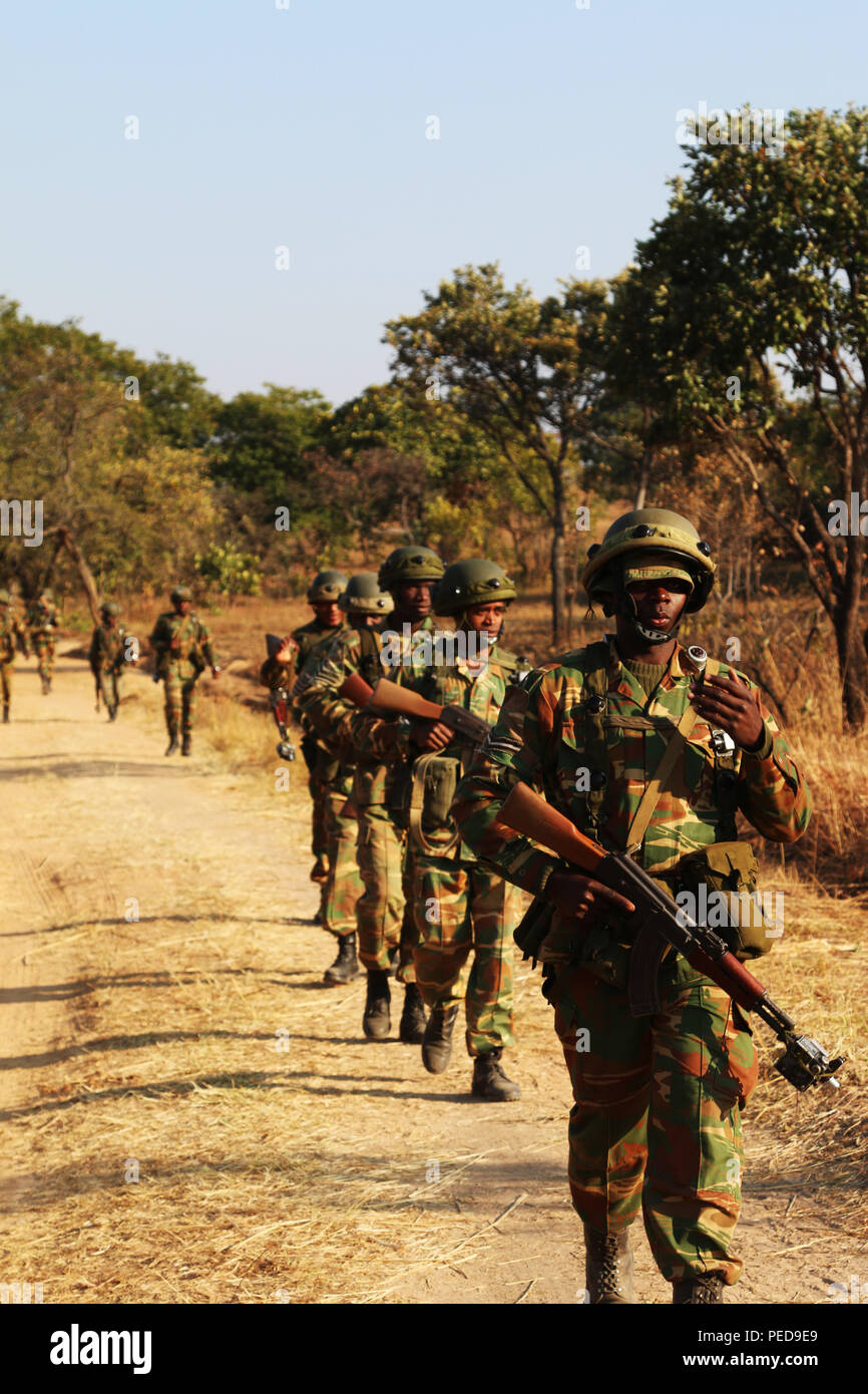 Soldiers from the Zambian Defense Force make their way to the mortar ...