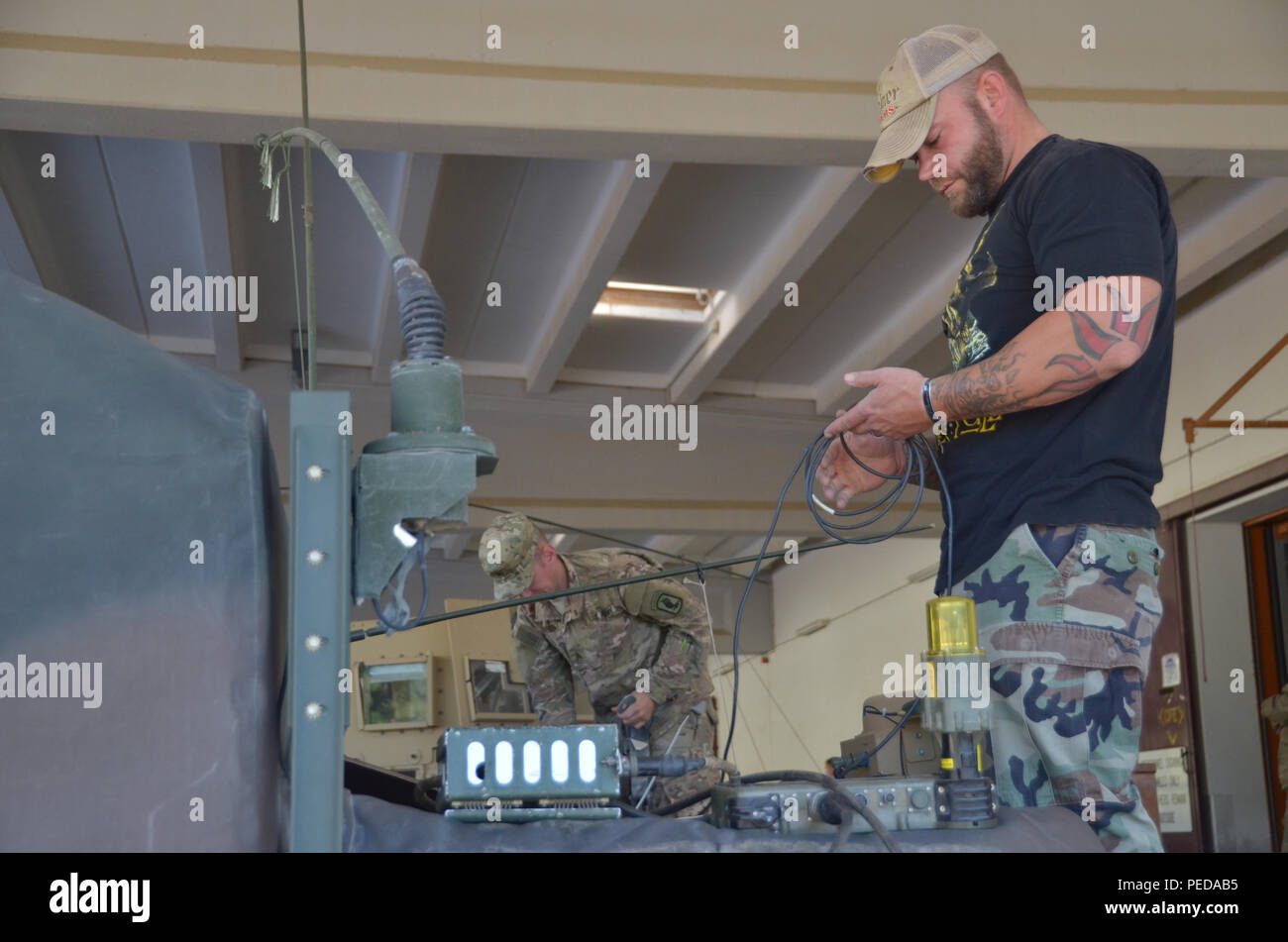 A Multiple Integrated Laser Engagement System (MILES) specialist wraps ...