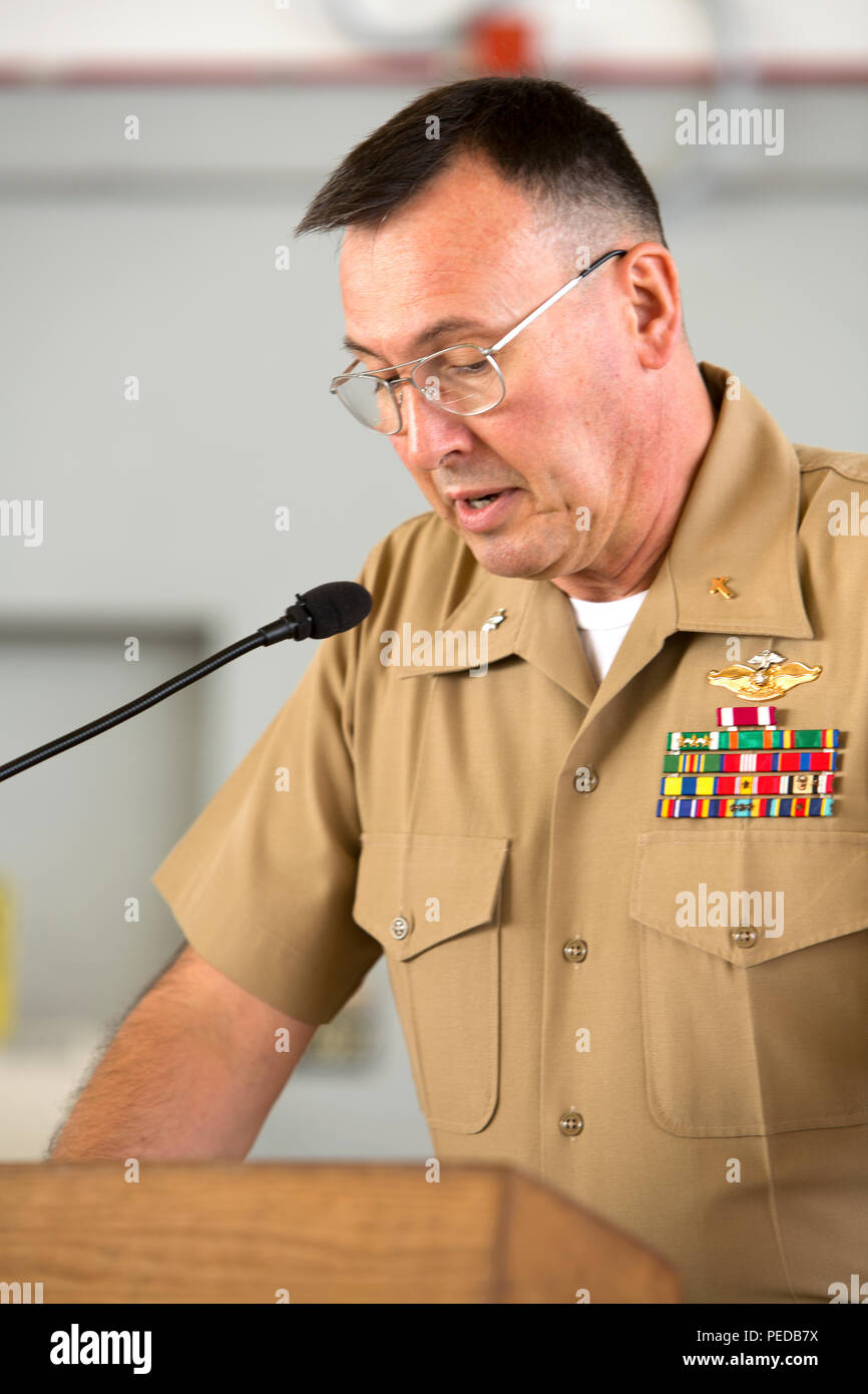 U.S. Navy CDR Jeffrey Plummer gives the opening invocation during the ...