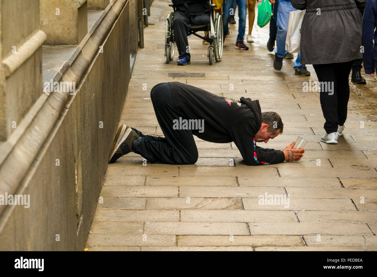 Barcelona Spain street beggar Stock Photo - Alamy