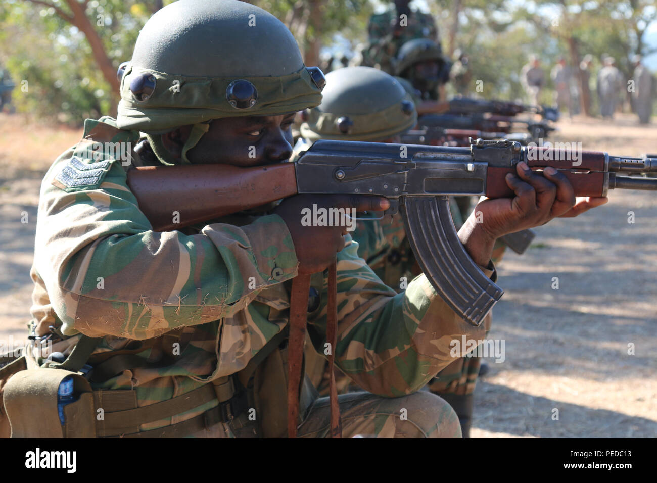 A Zambian Soldier scans his sector of fire during squad movements ...