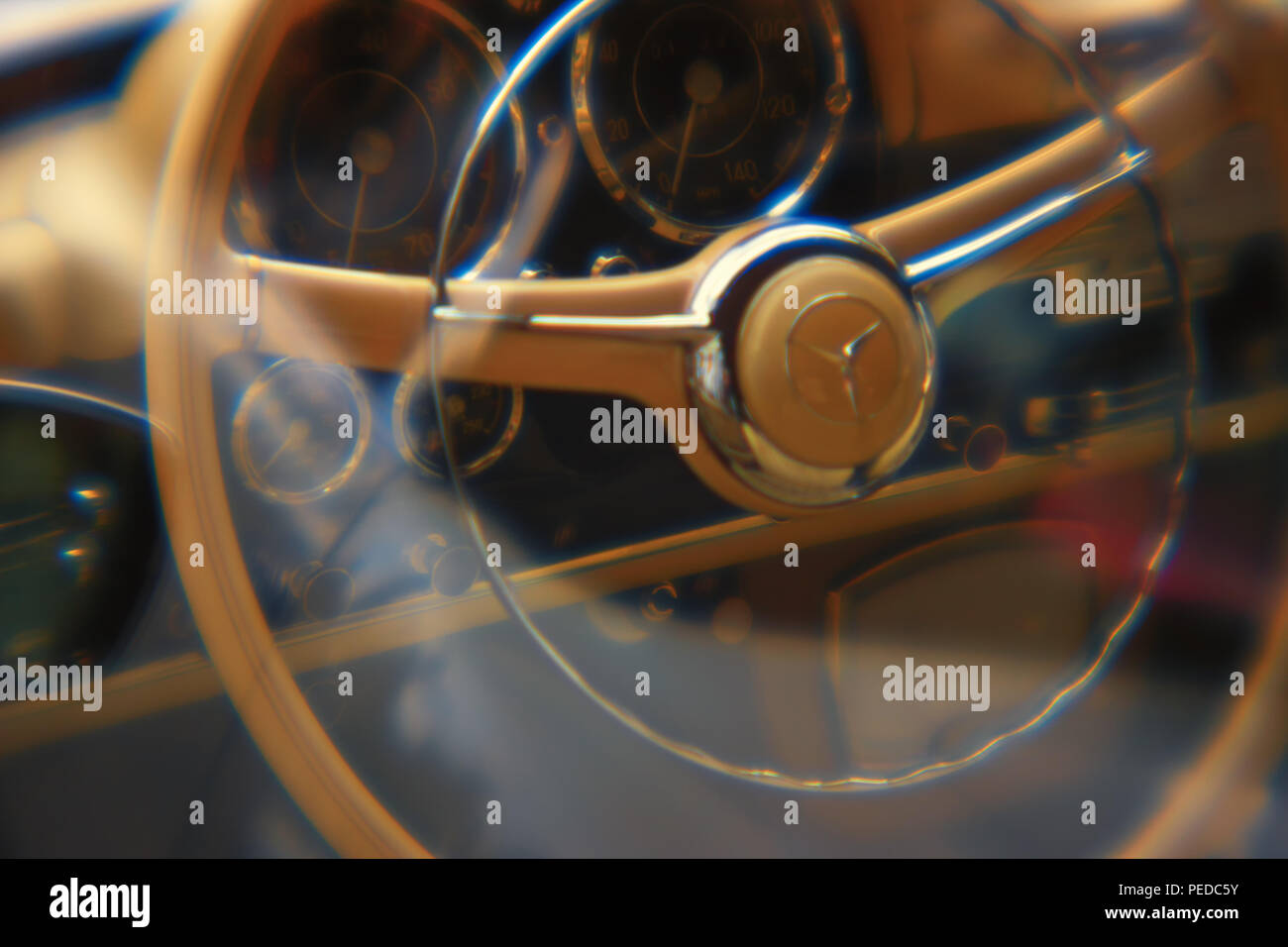 Blurry yellow wheel vintage car interior and dashboard with round ...