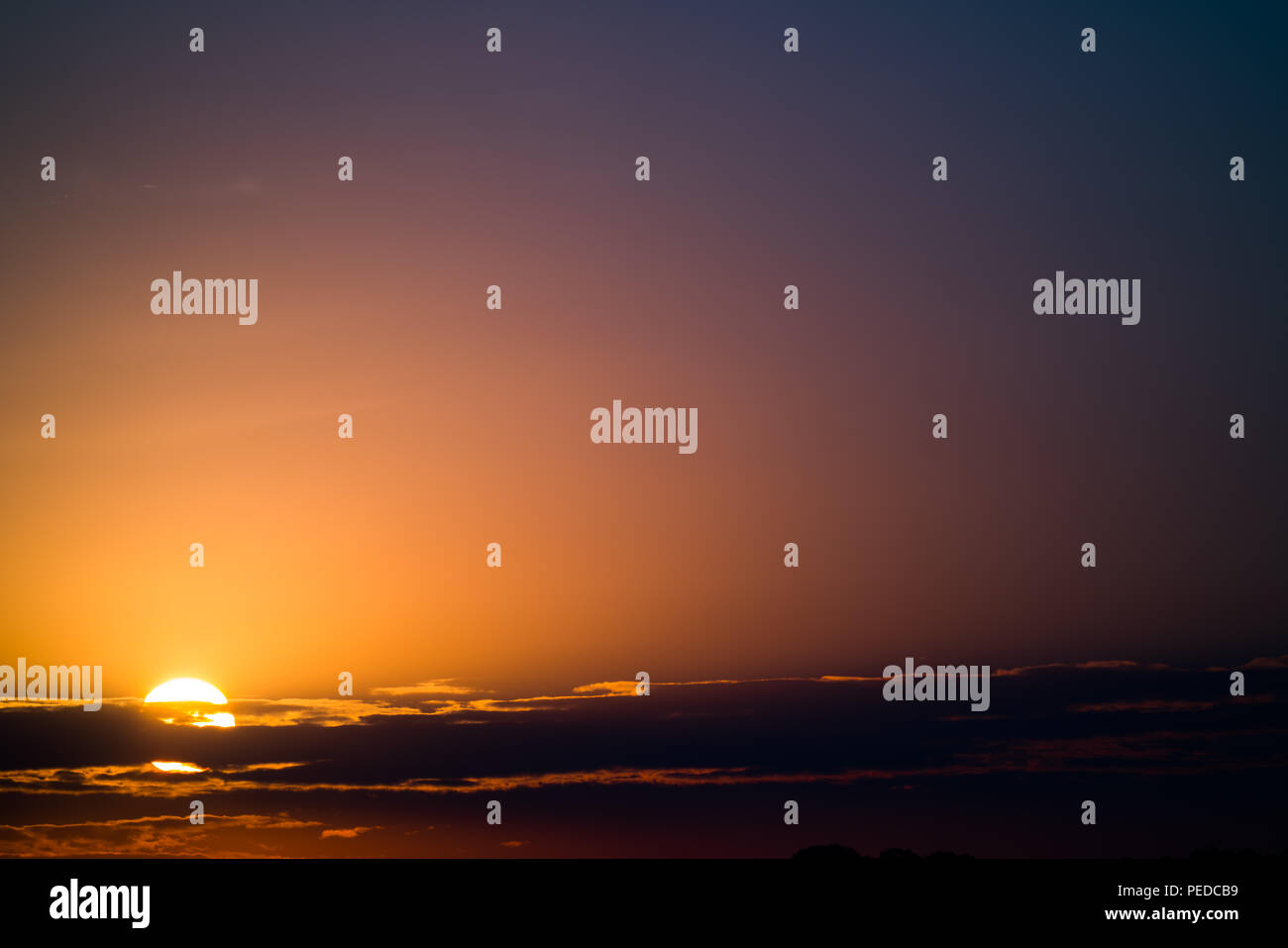 Sunset sun on sky Stock Photo - Alamy
