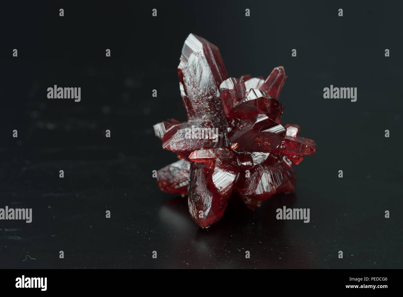 Red natural crystal. Natural mineral Stock Photo - Alamy