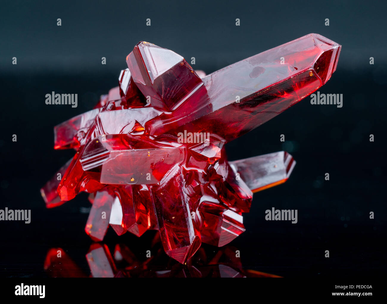 red crystal of natural origin. close up of crystals in ruby color on ...