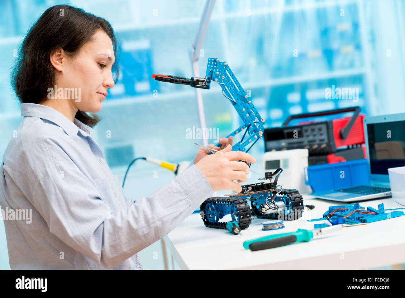 Young woman in CNC and robotics laboratory Stock Photo - Alamy