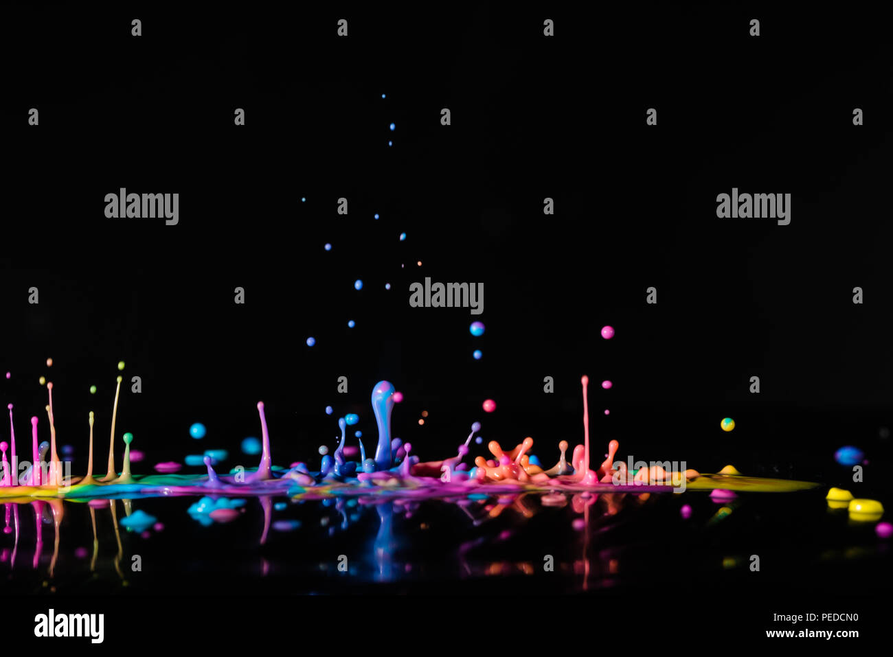 abstract color splash isolated on black background Stock Photo - Alamy