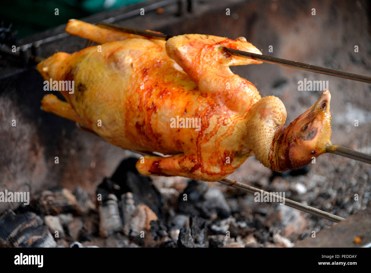 Duck on a spit, Sa Pa, Vietnam Stock Photo - Alamy