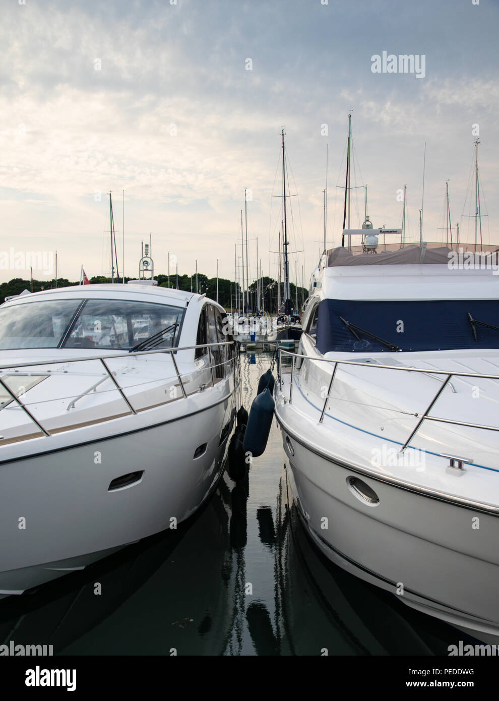 Hamble-le-Rice, United Kingdom - July 21 2018: Two luxury cruisers tied ...