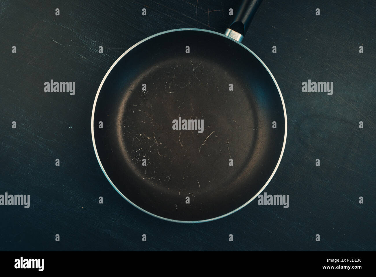 Used old empty frying pan skillet top view on dark background Stock ...
