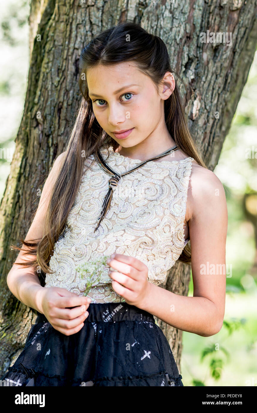 Beautiful child model Bailey works through different looks on a shoot ...