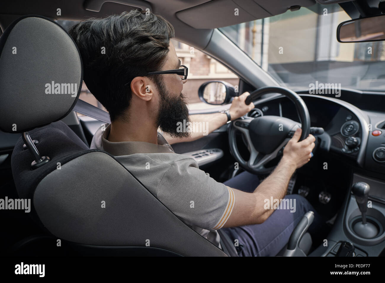 Handsome, happy man driving the car Stock Photo - Alamy