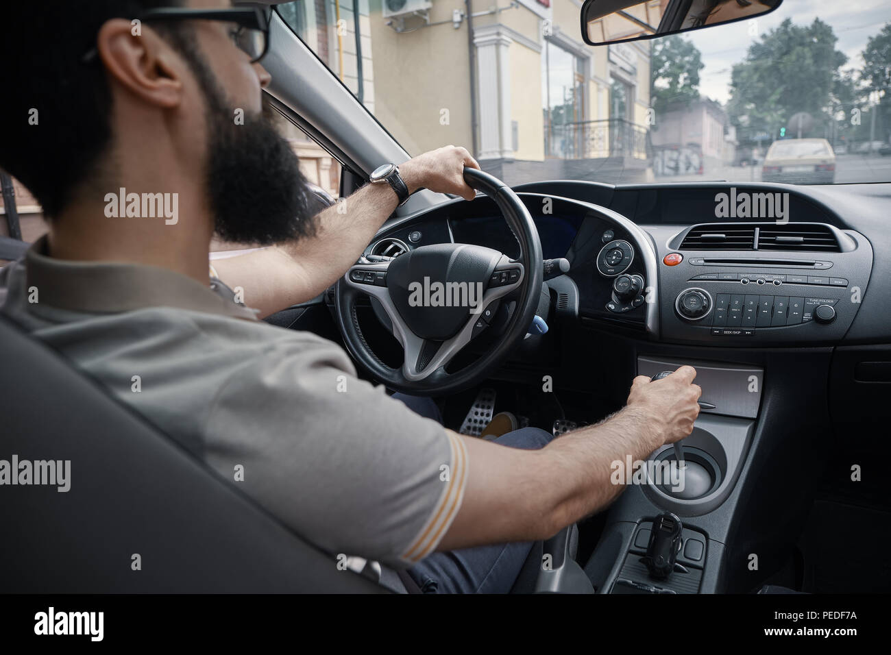 Handsome man driving the car Stock Photo - Alamy