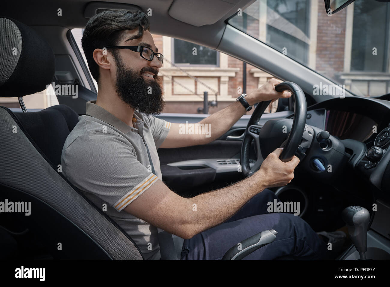 Handsome, happy man driving the car Stock Photo - Alamy