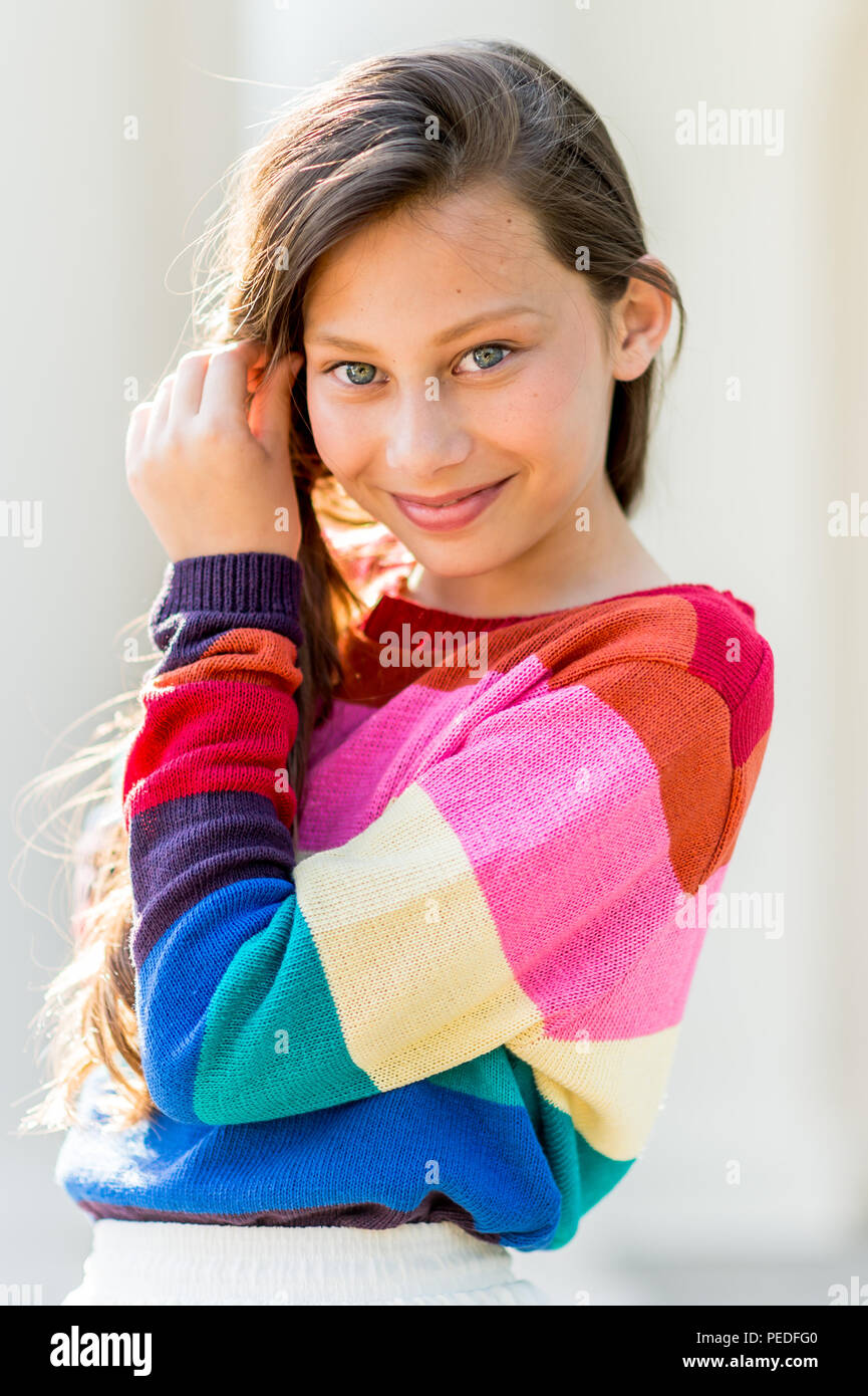 Beautiful child model Bailey works through different looks on a shoot ...