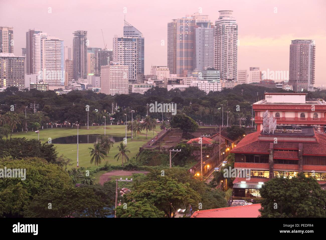 Manila city skyline in sunset light in Philippines. Ermita and Paco ...