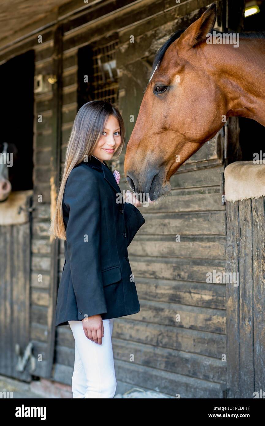 Beautiful child model Bailey works through different looks on a shoot ...