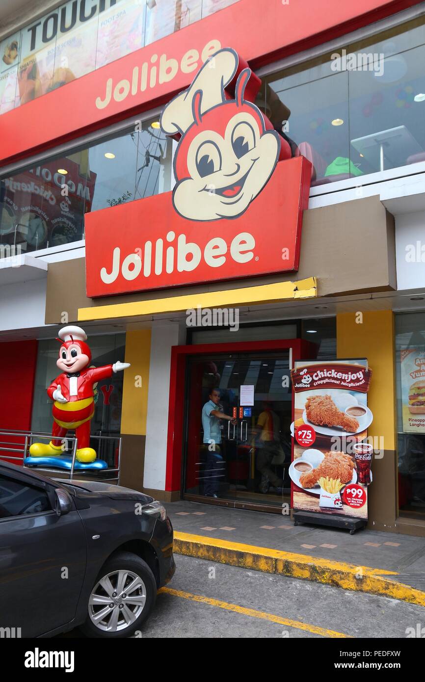 MANILA, PHILIPPINES - DECEMBER 7, 2017: People visit Jollibee fast food ... MANILA, PHILIPPINES - DECEMBER 7, 2017: People visit Jollibee fast food ...