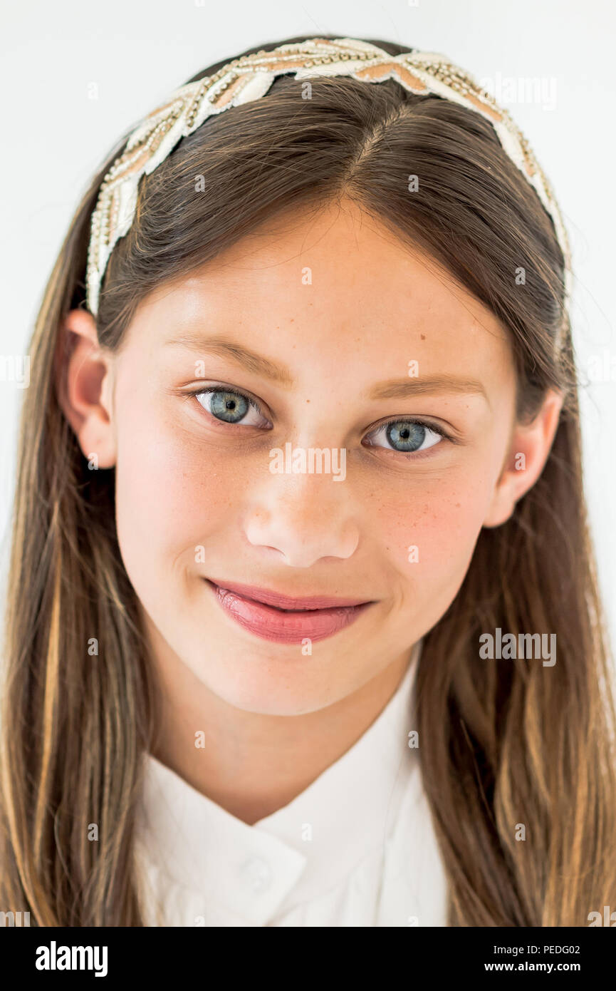 Beautiful child model Bailey works through different looks on a shoot ...