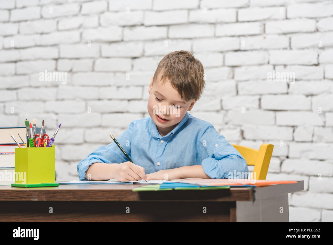 Young boy learning for school Stock Photo - Alamy