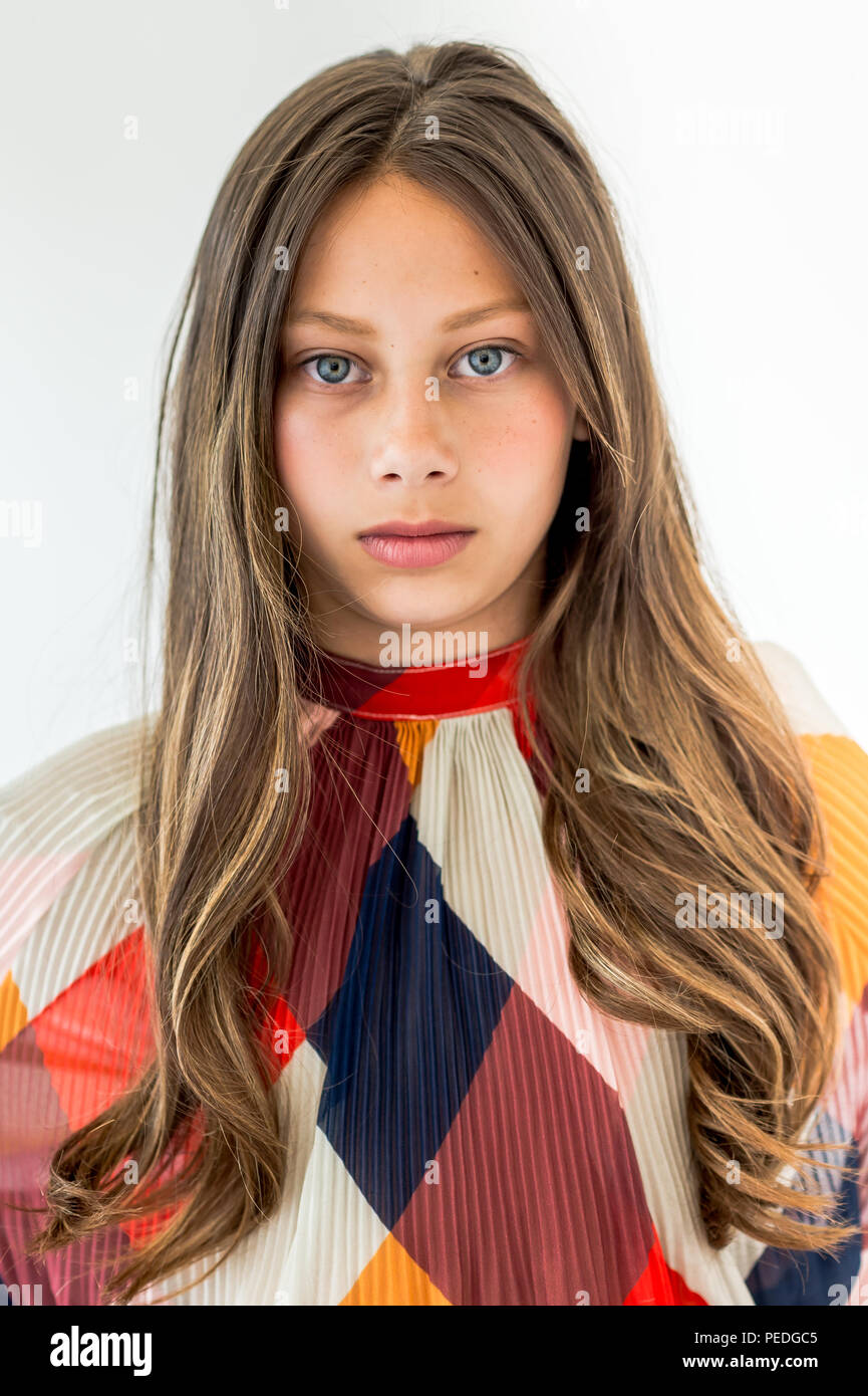 Beautiful child model Bailey works through different looks on a shoot ...