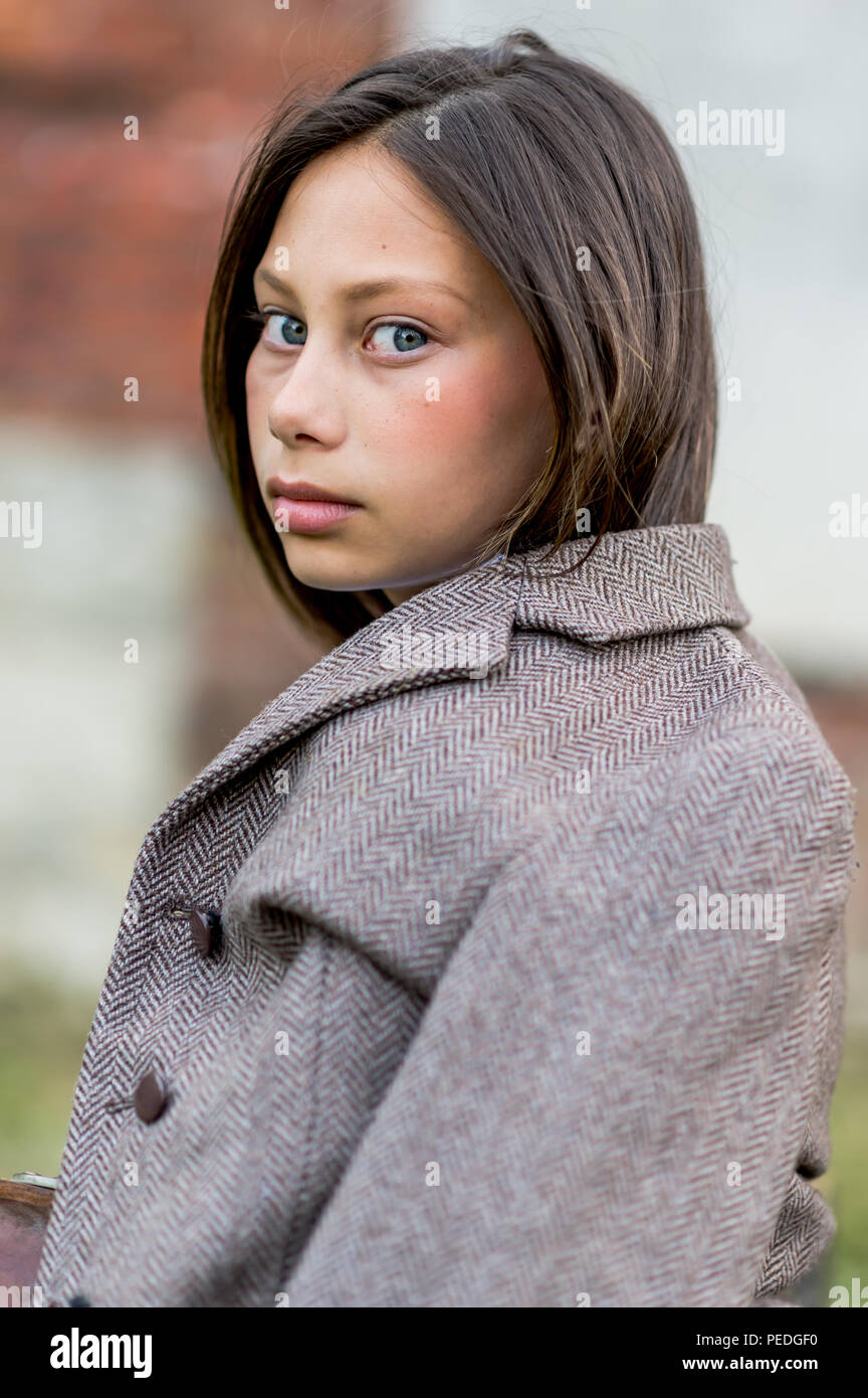 Beautiful child model Bailey works through different looks on a shoot ...