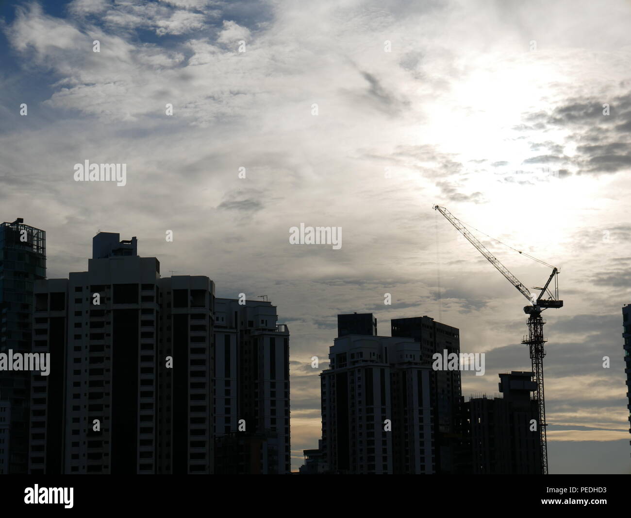 Sunset behind buildings with beautiful cloudy sky. Beautiful red ...