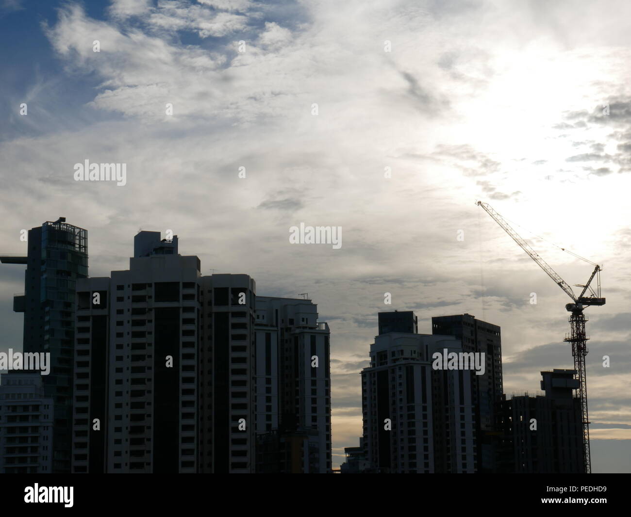 Sunset behind buildings with beautiful cloudy sky. Beautiful red ...
