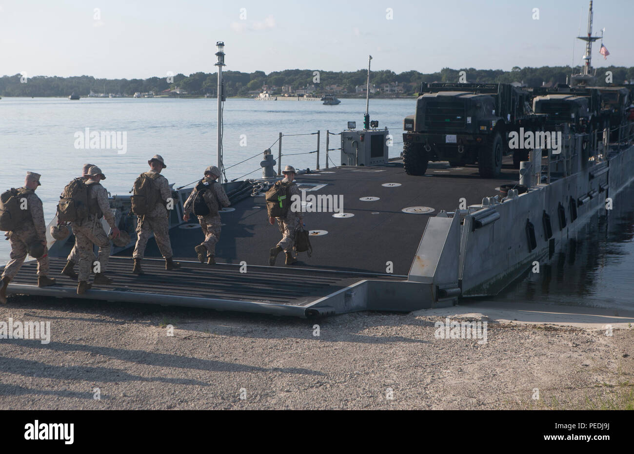 Marines with Combat Logistics Regiment 25, board an Improved Navy ...