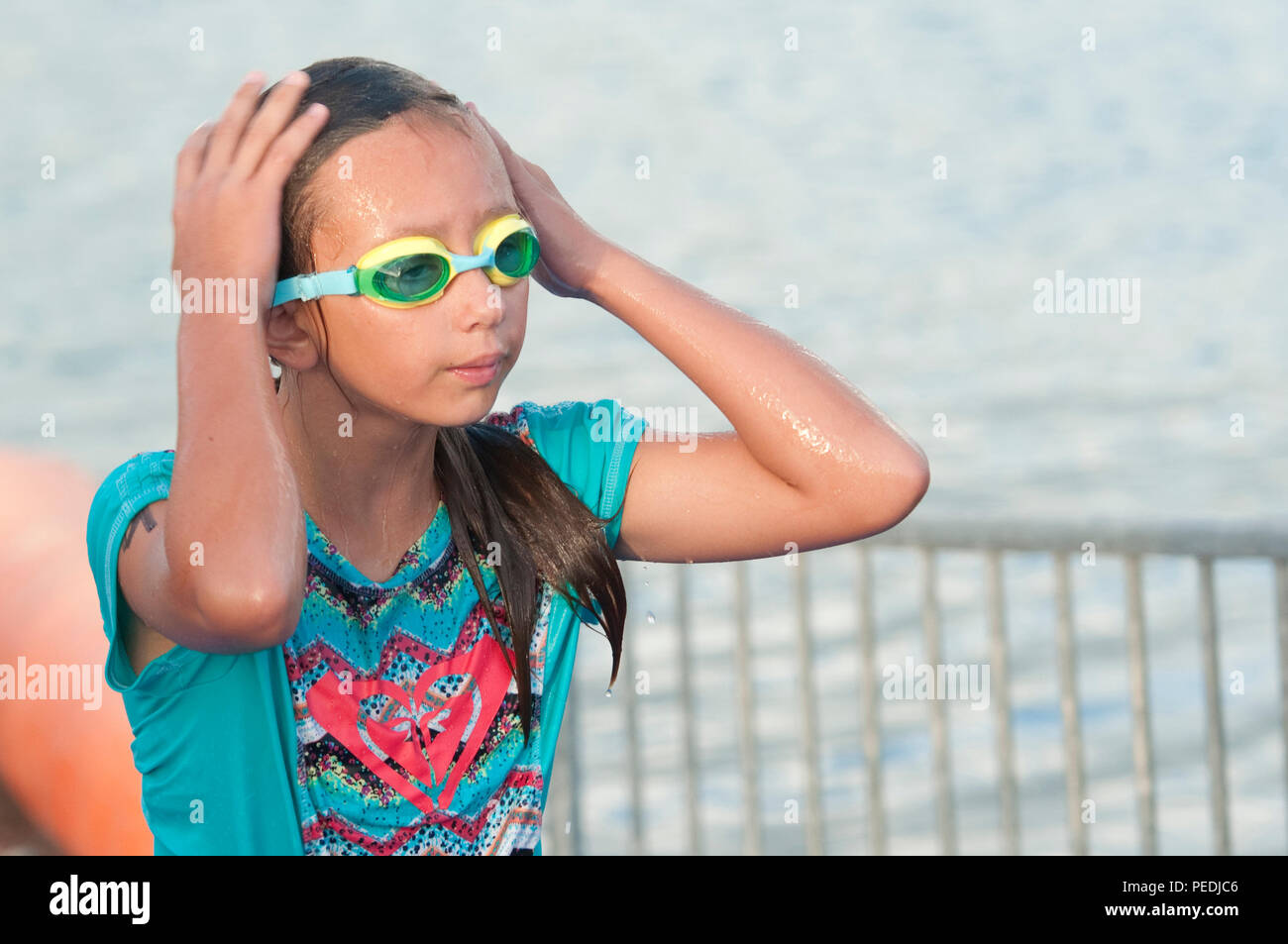 Triathlon participant Emma Boyle emerges from Kaneohe Bay during the ...
