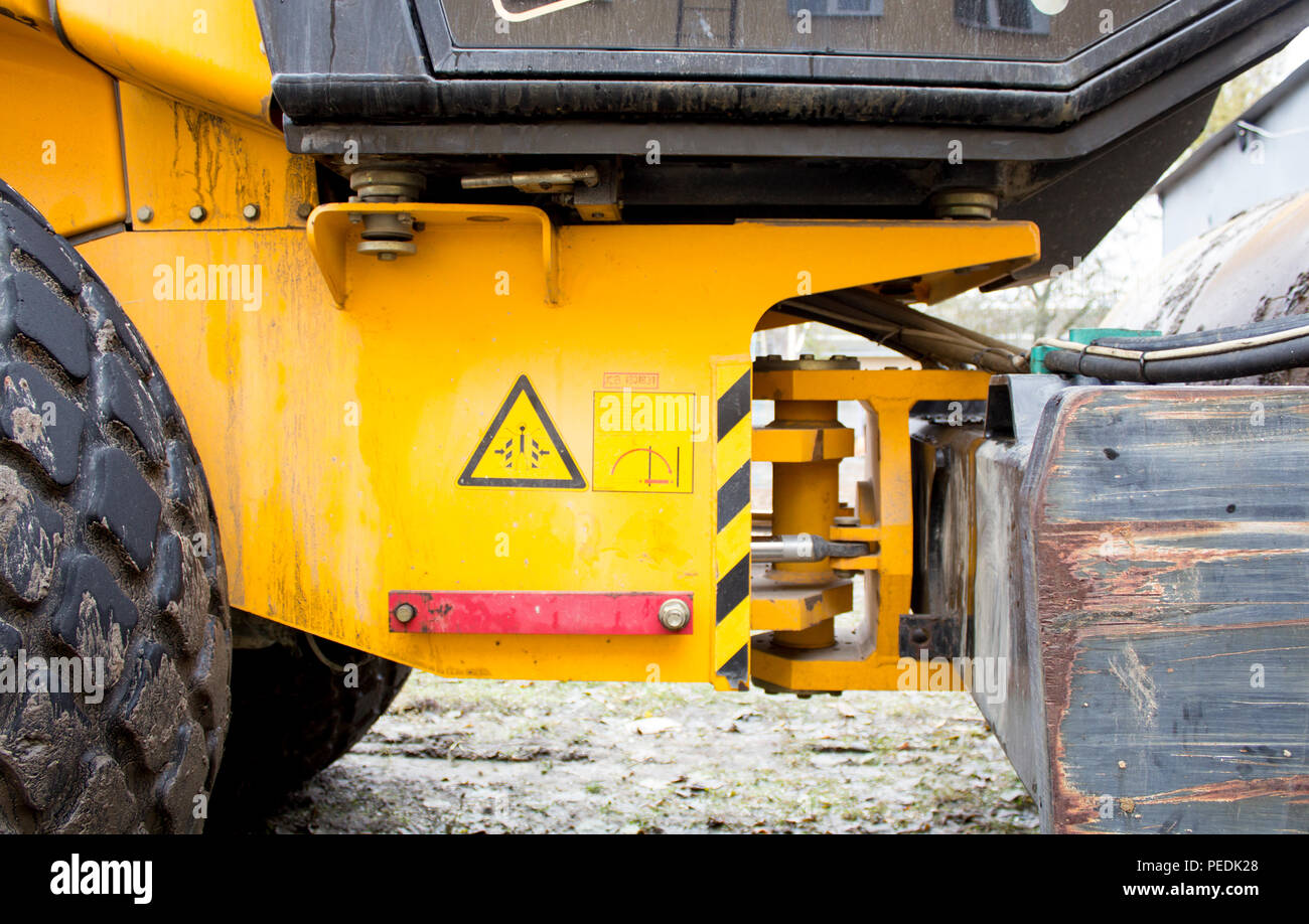 Men at work, asphalt laying. Road-building. Road construction machinery ...