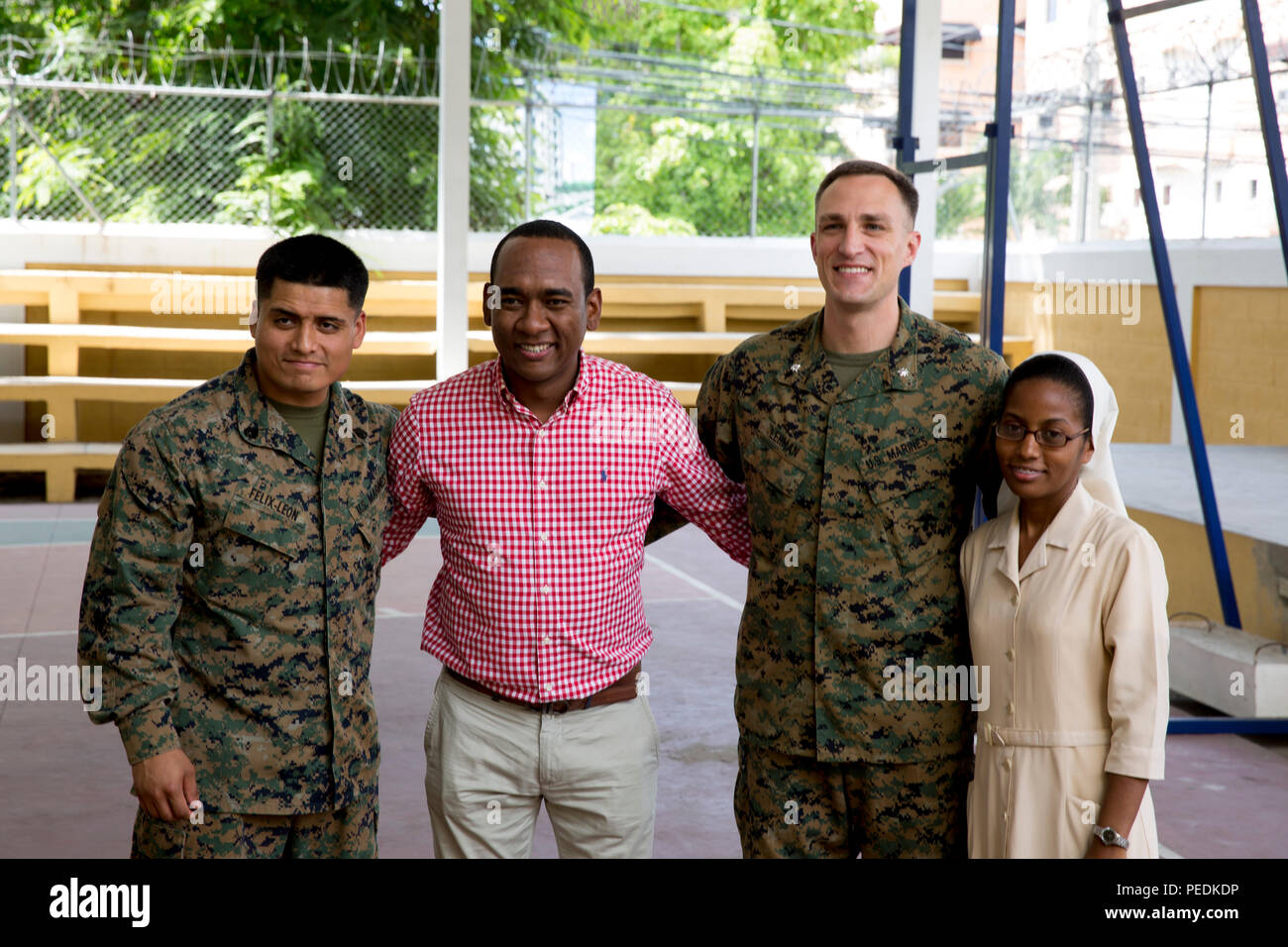 U.S. Marines assigned to 4th Civil Affairs Group, pose for a photo with ...