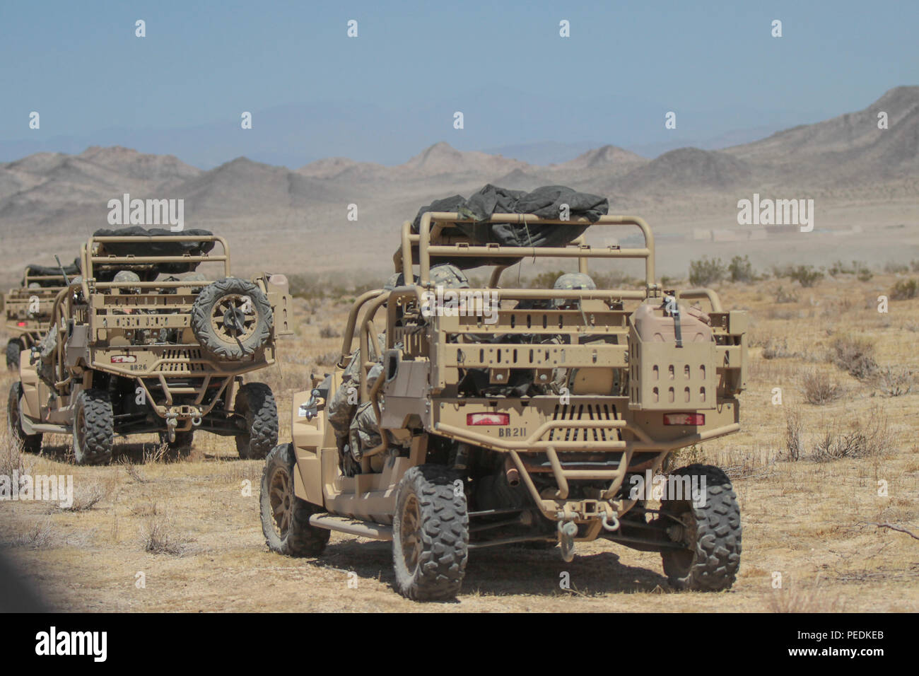 Ultra-lightweight combat vehicles bearing paratroopers assigned to the ...