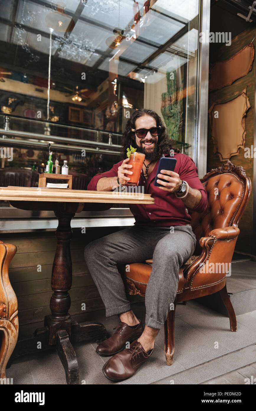 Happy delighted man enjoying his rest Stock Photo - Alamy