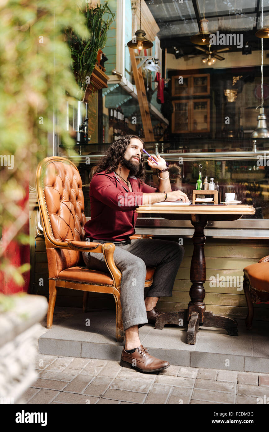 Creative nice man looking for ideas Stock Photo - Alamy