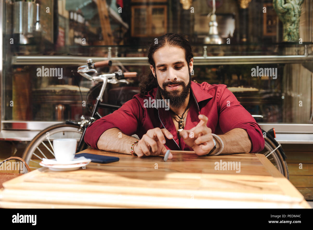 Delighted bearded man playing with a chip Stock Photo - Alamy