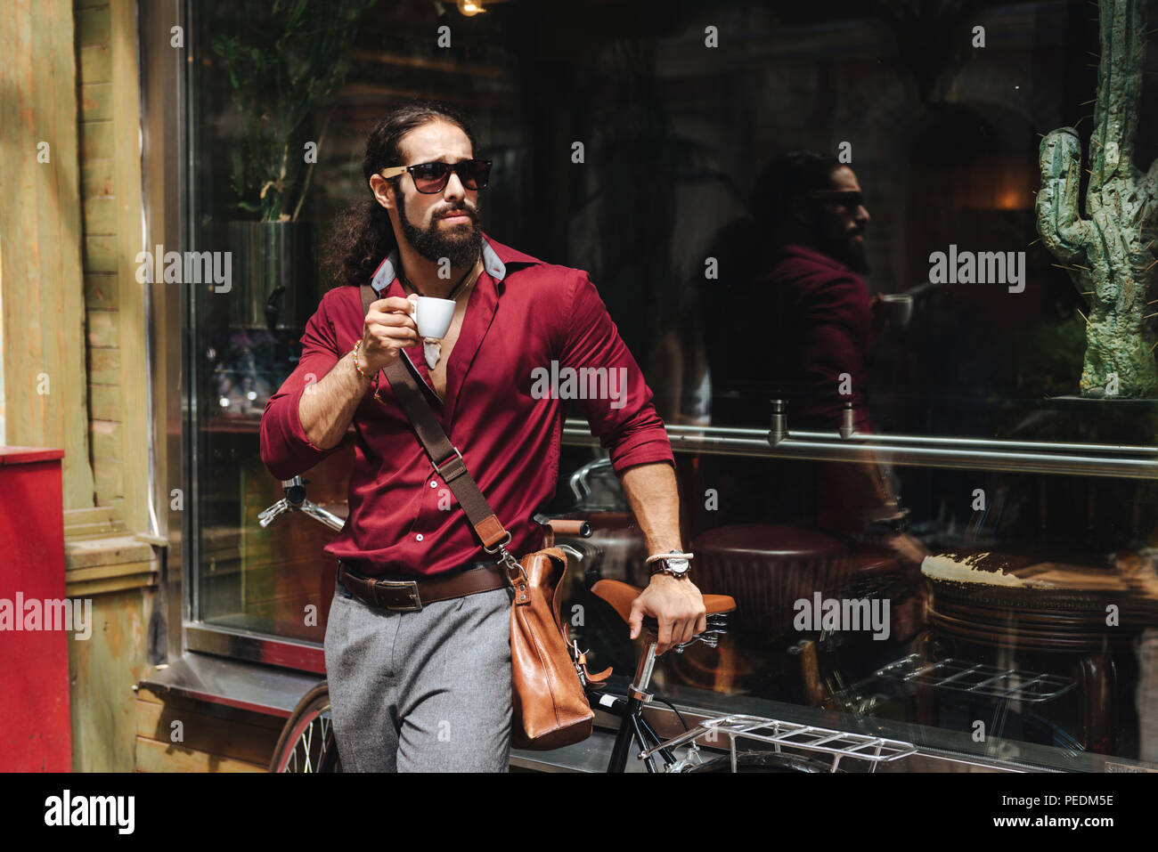 Nice handsome man enjoying his coffee Stock Photo - Alamy