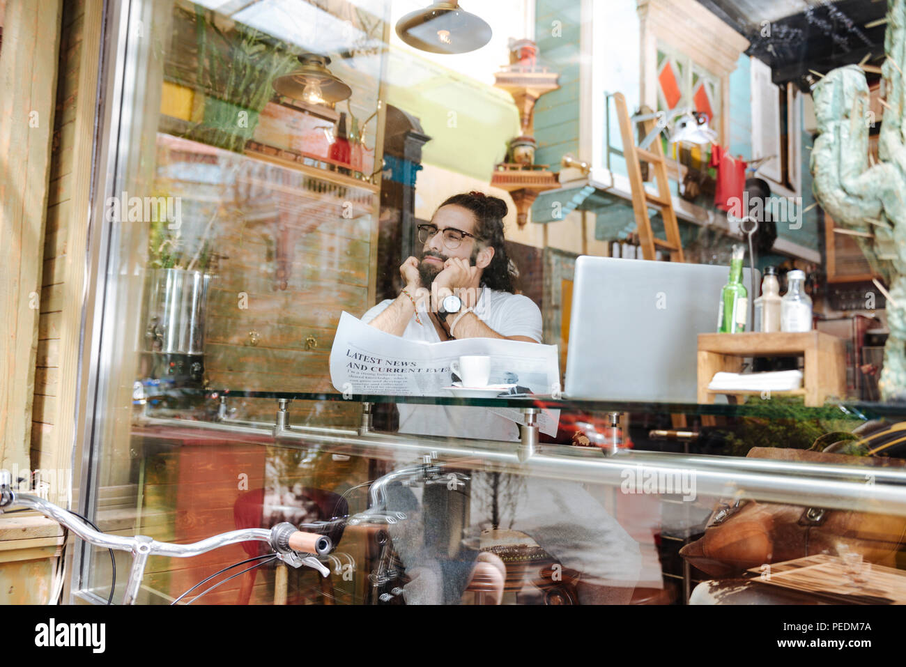 Nice delighted man looking into the window Stock Photo - Alamy